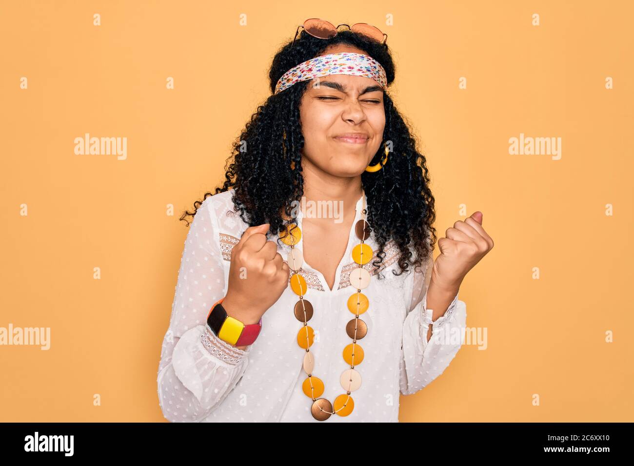 Young african american curly hippie woman wearing sunglasses and ...