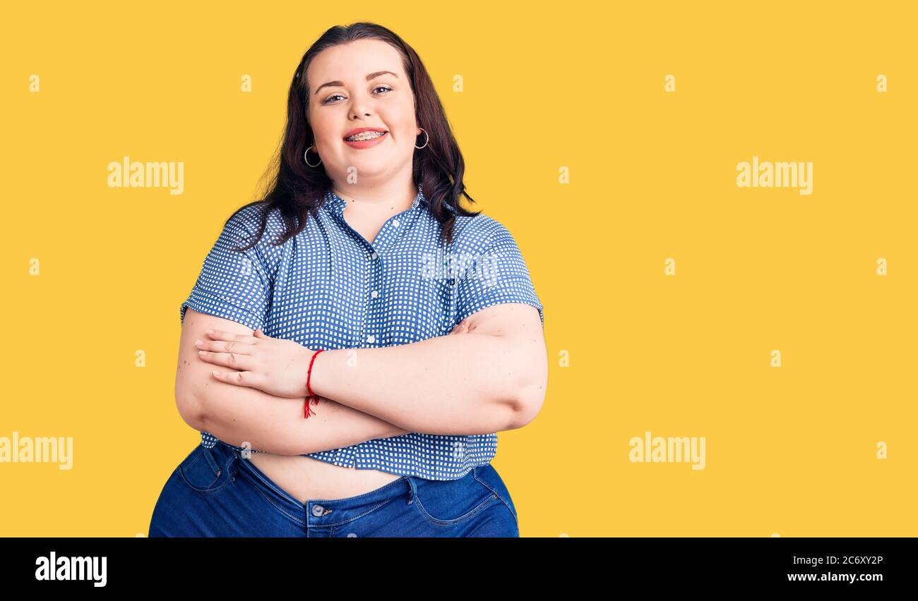 Young plus size woman wearing casual clothes happy face smiling with ...