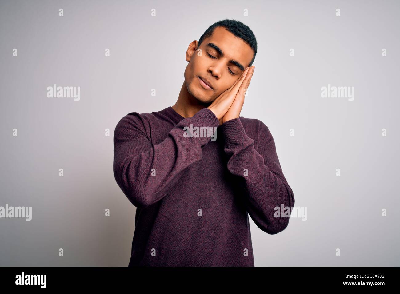 Young handsome african american man wearing casual sweater over white ...