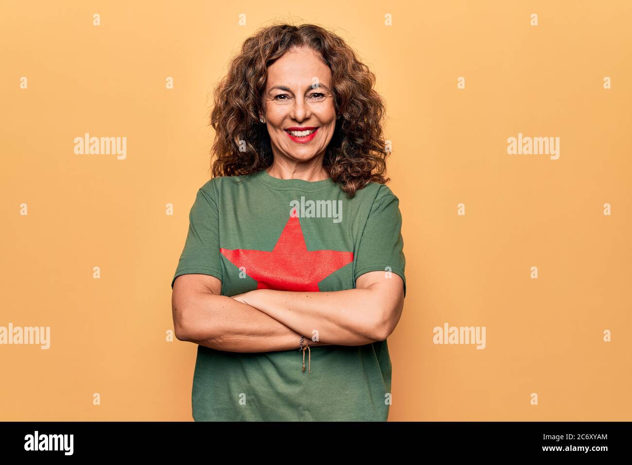 Middle age beautiful woman wearing t-shirt with red star revolutionary ...