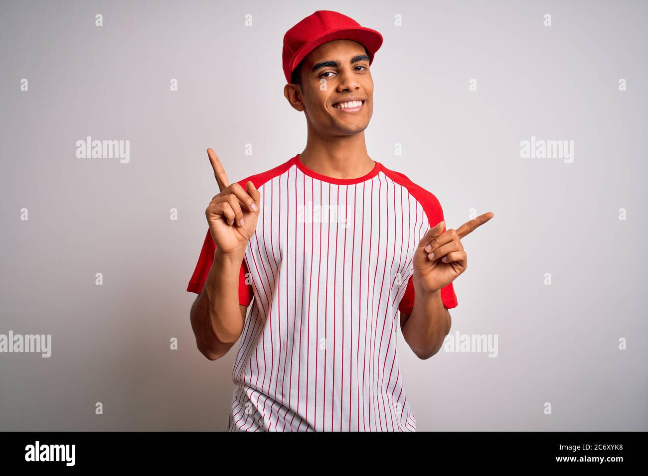Young handsome african american sportsman wearing striped baseball t ...