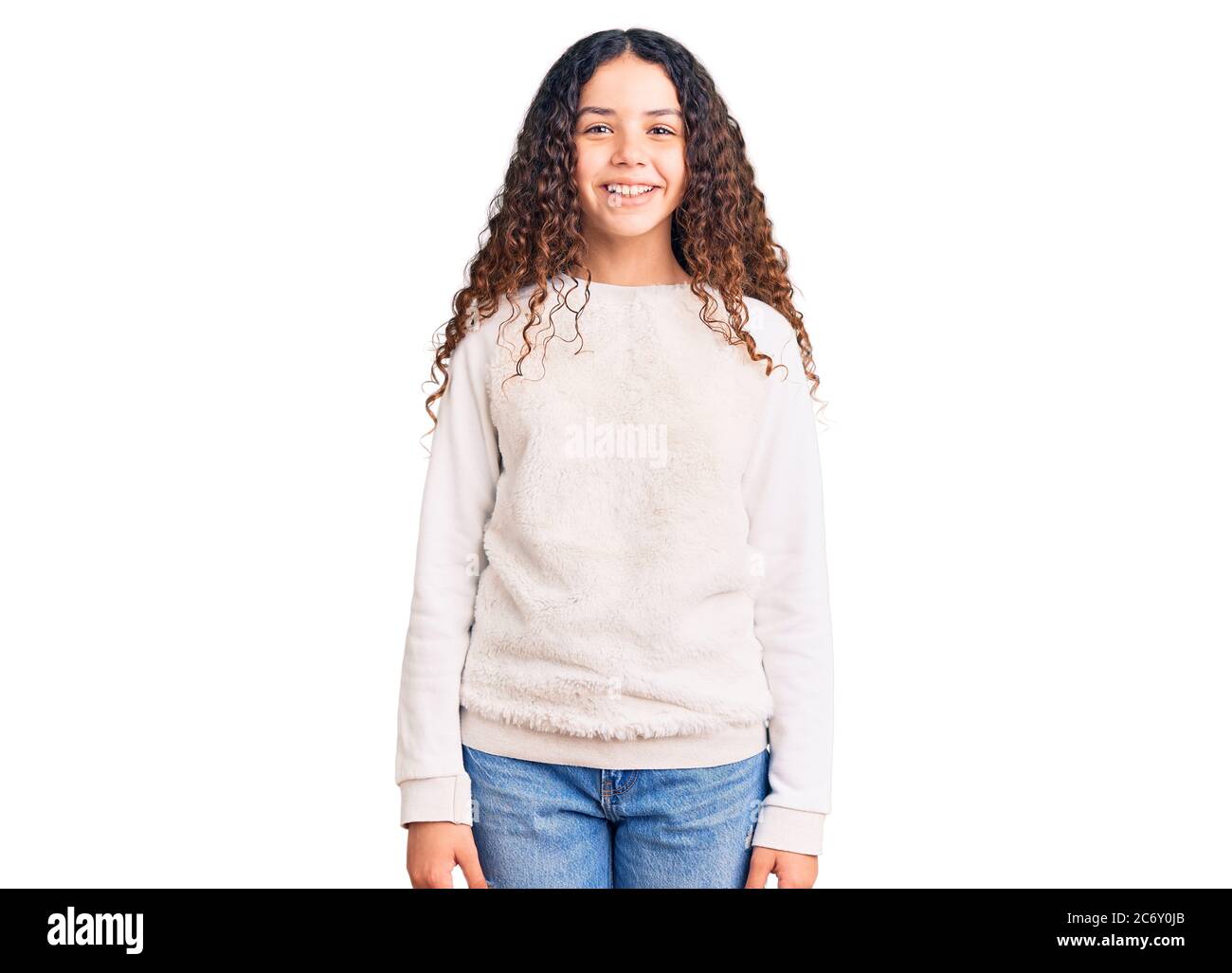 Beautiful kid girl with curly hair wearing casual clothes with a happy ...