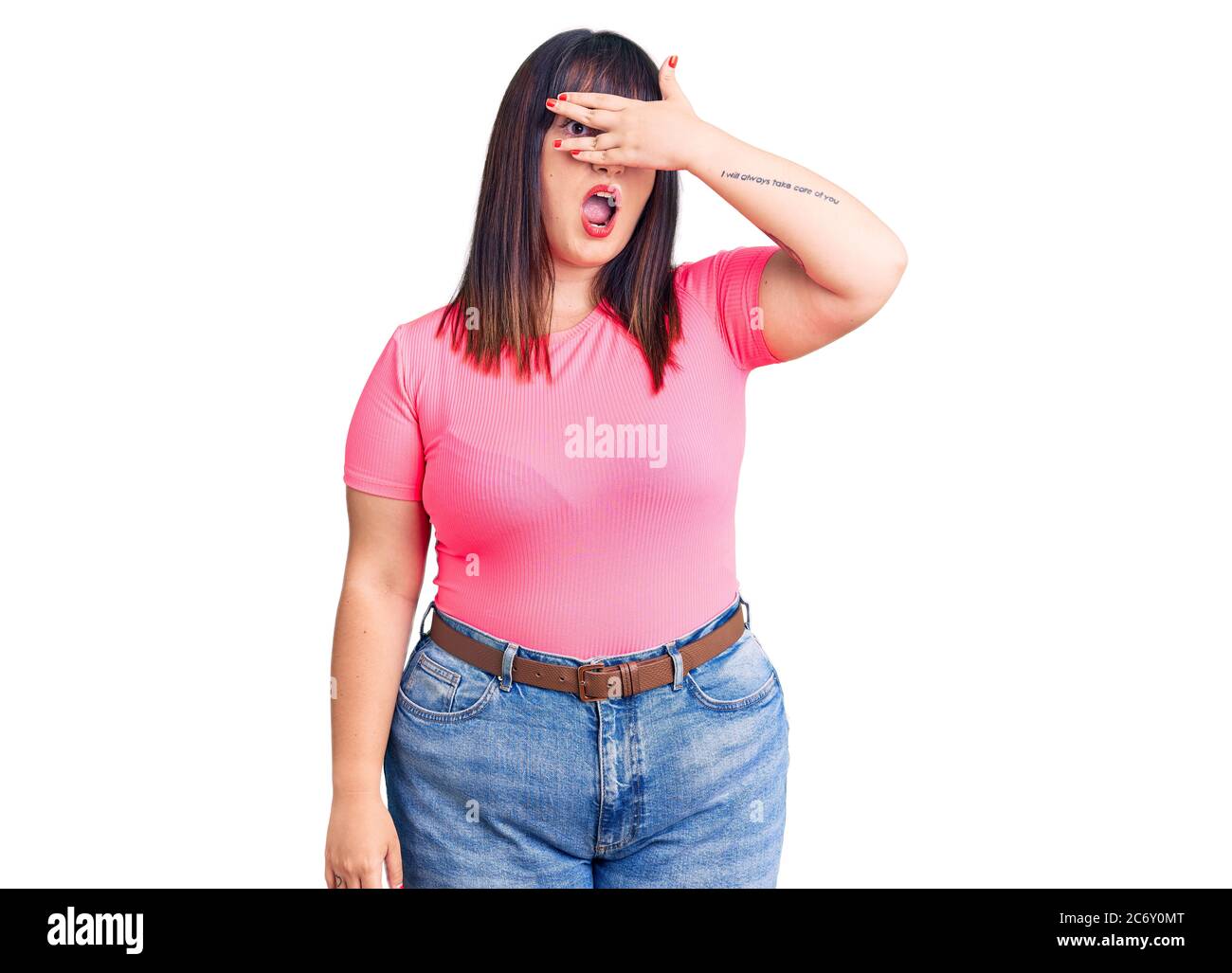 Young Plus Size Woman Wearing Casual Clothes Peeking In Shock Covering