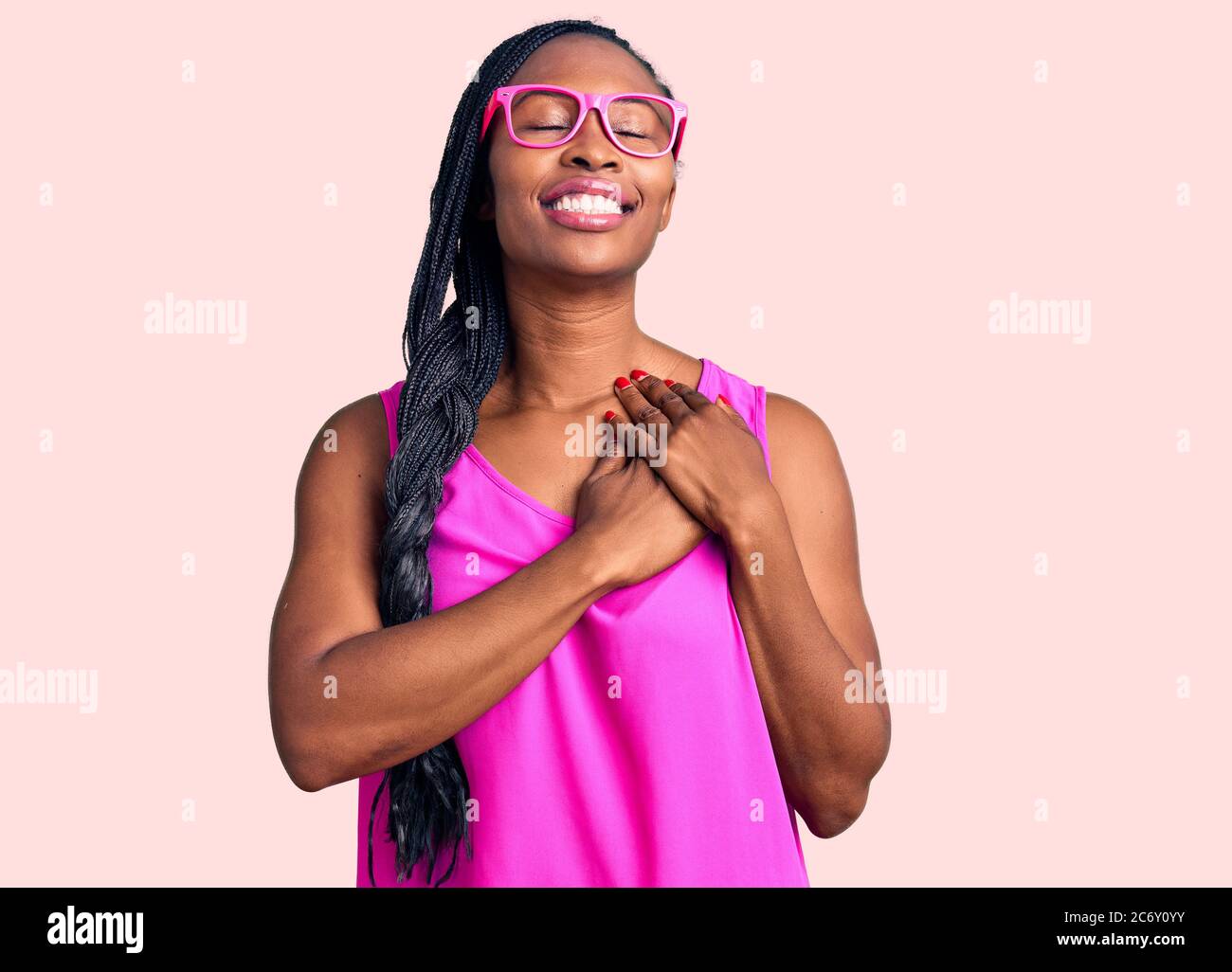 Young african american woman wearing casual clothes and glasses smiling ...