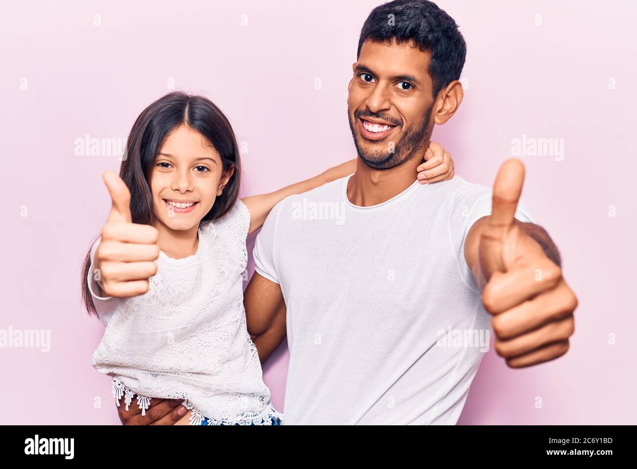 Young father and daughter wearing casual clothes approving doing ...