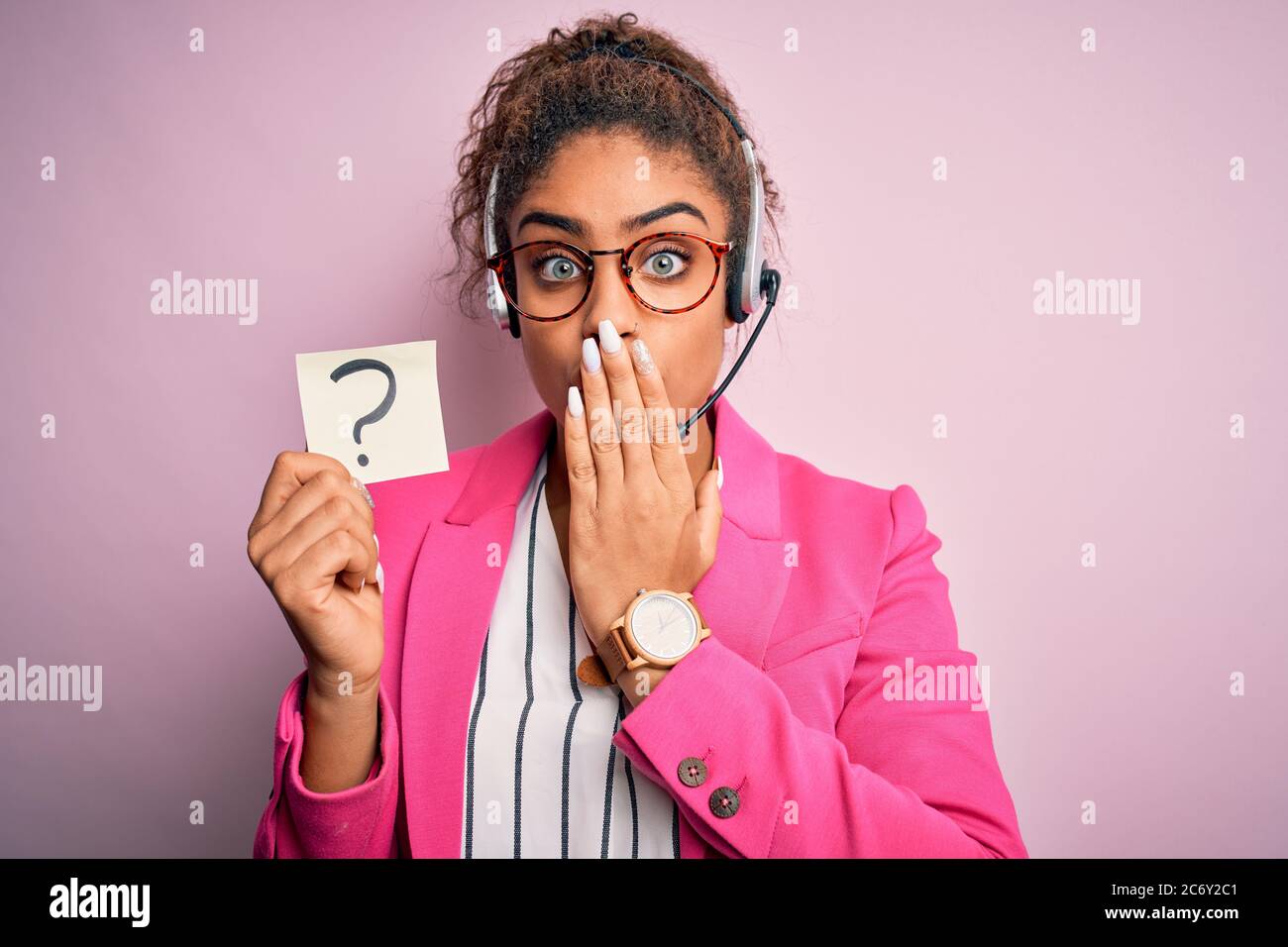 African american call center agent girl working using headset holding ...