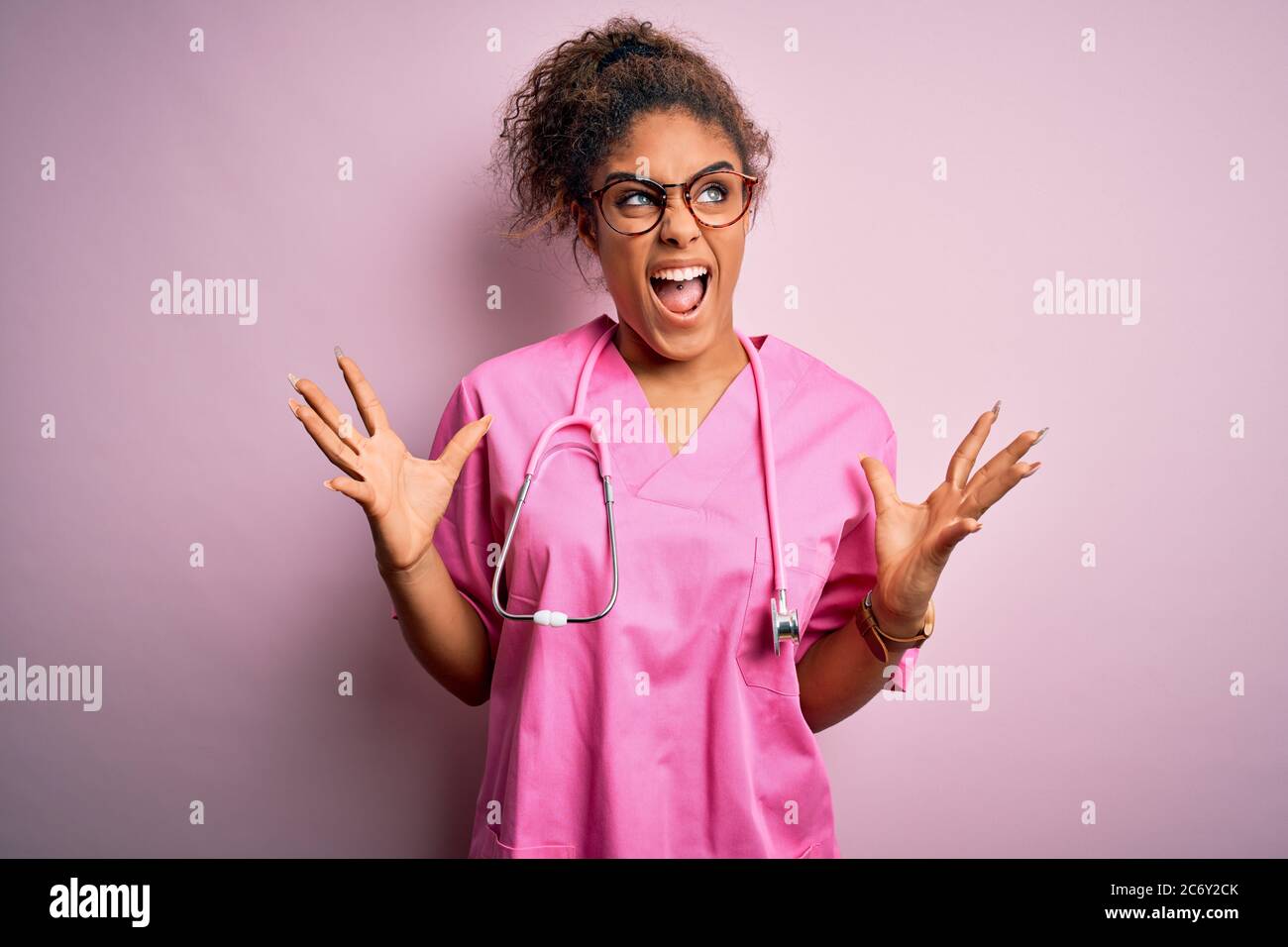 African american nurse girl wearing medical uniform and stethoscope ...