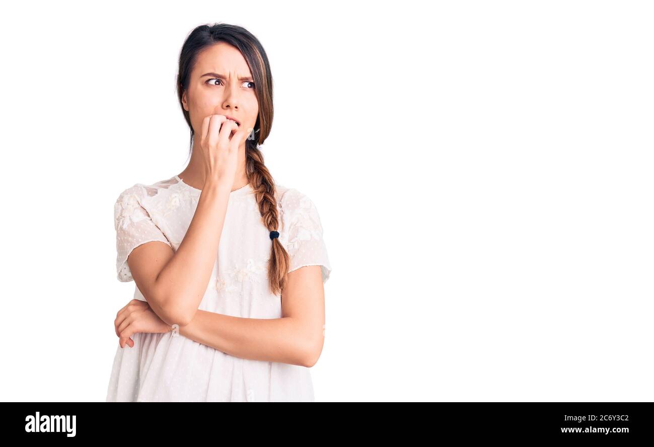 Young beautiful girl wearing casual t shirt looking stressed and ...