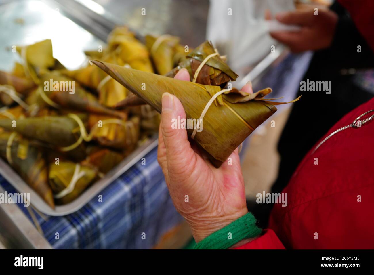 Bunches of zongzi, a traditional Chinese rice dish made of glutinous ...