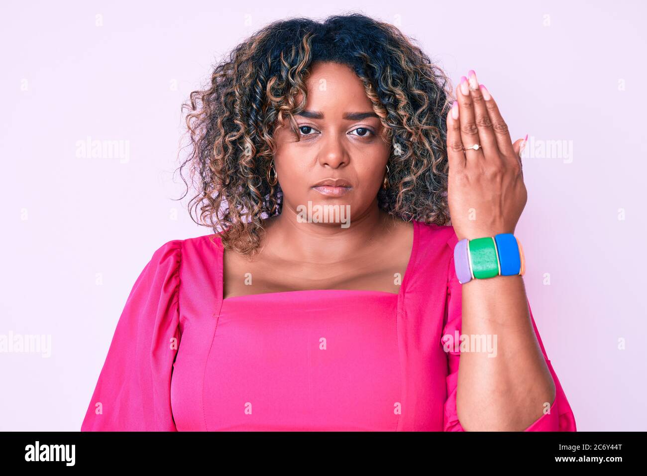 Young african american plus size woman wearing engagement ring thinking ...