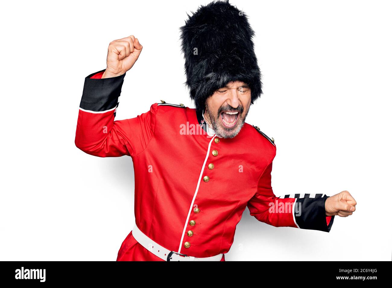 Middle age handsome wales guard man wearing traditional uniform over ...