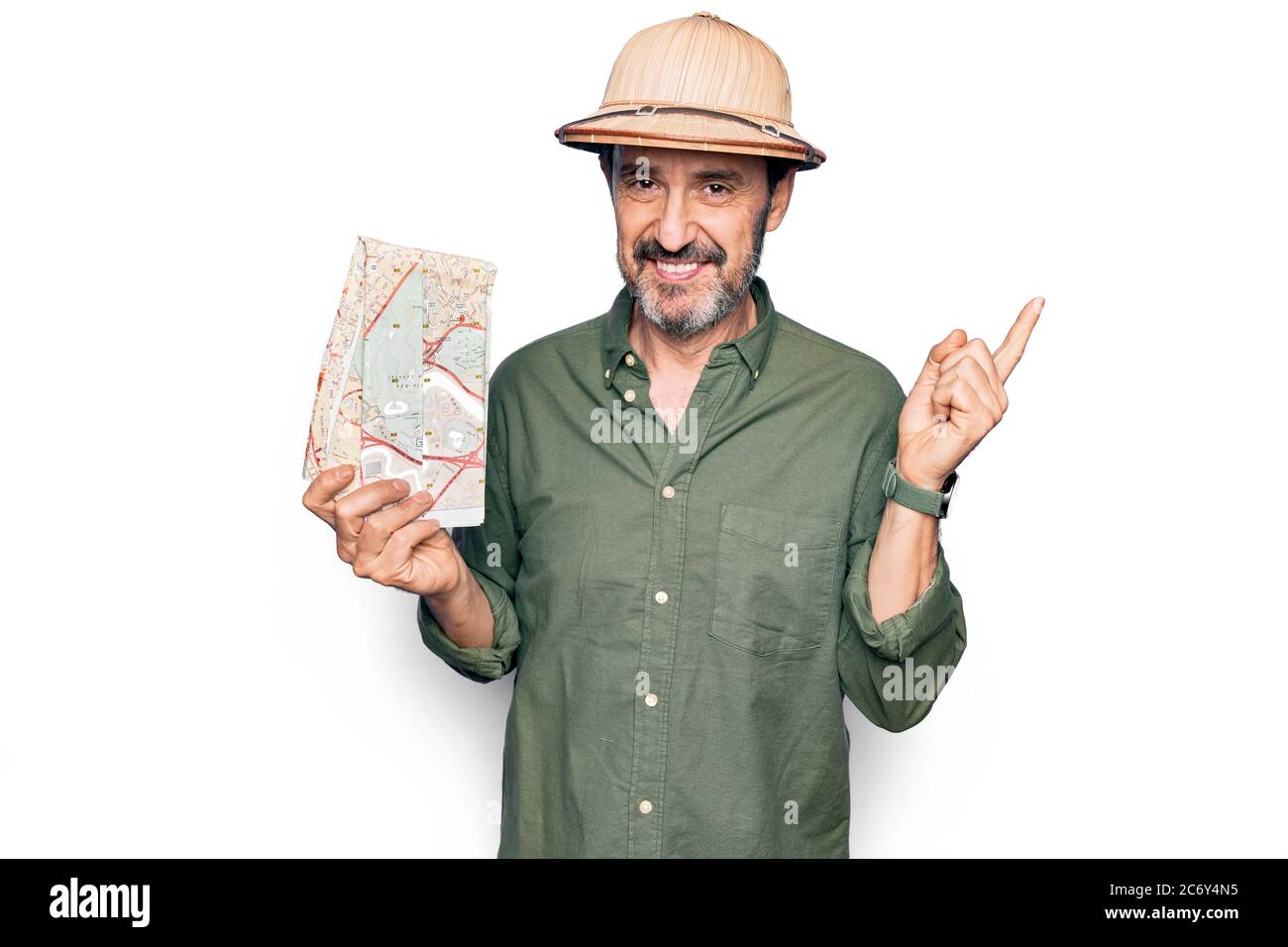 Middle age handsome tourist man on vacation wearing explorer hat ...