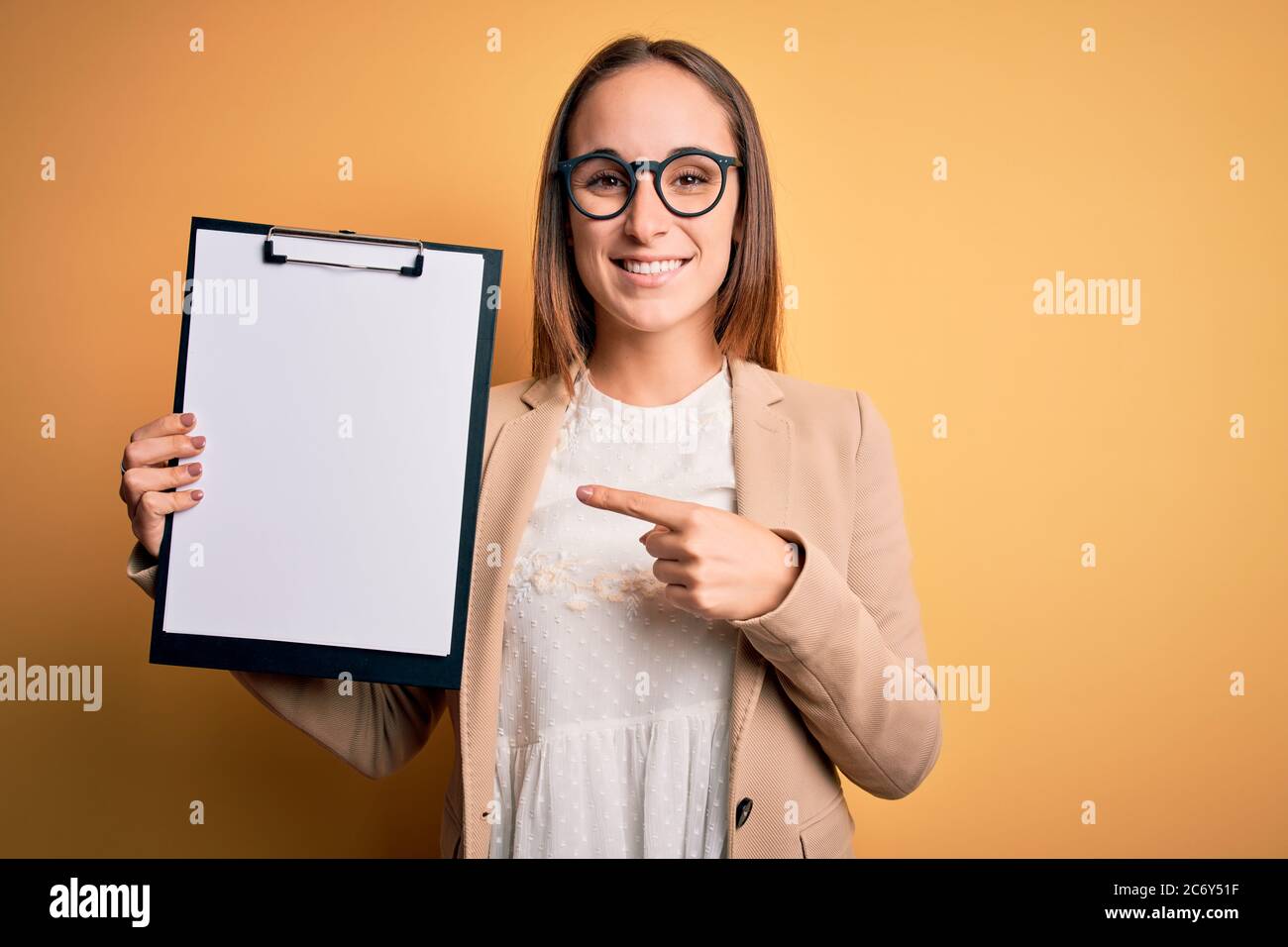 Beautiful inspector woman wearing glasses holding checklist clipboard ...