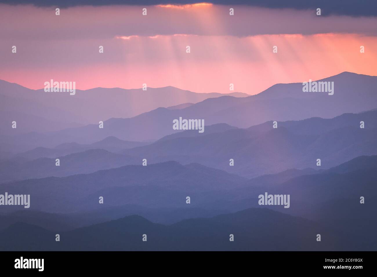 The sun breaks through dark clouds hi-res stock photography and images ...