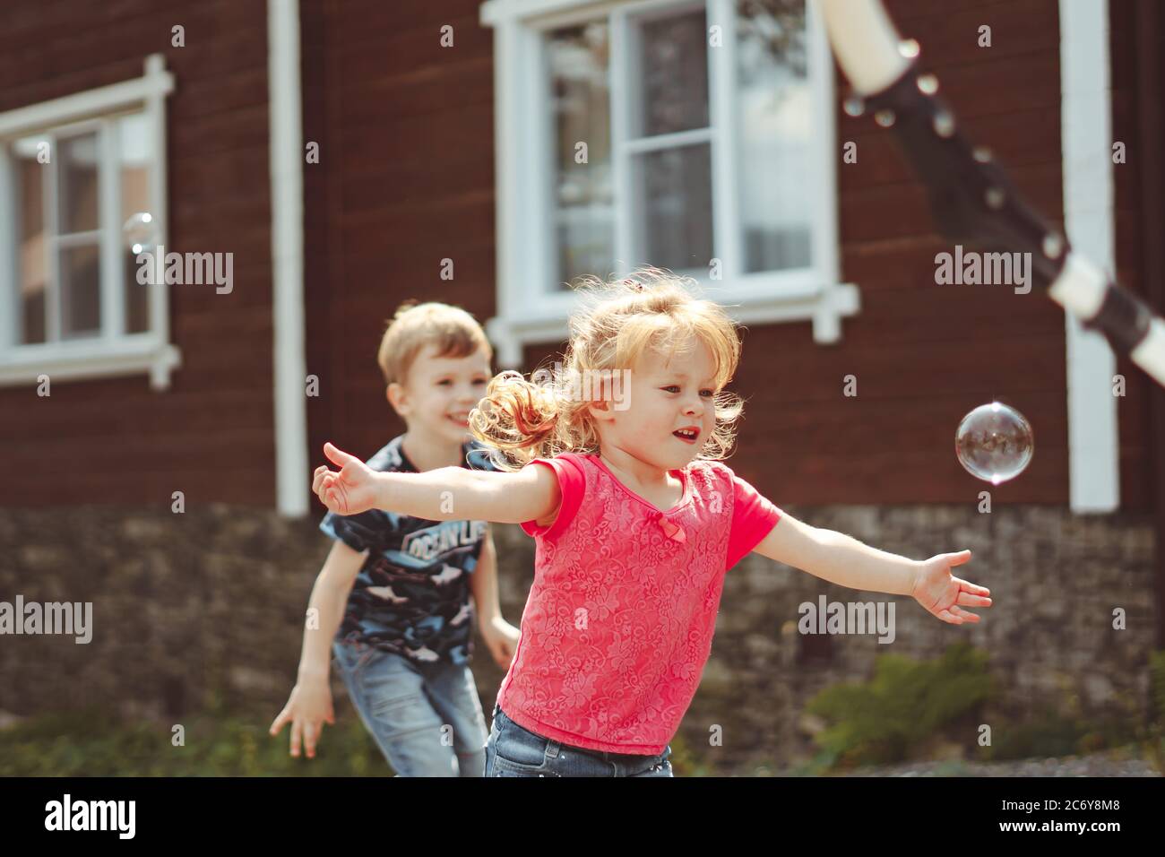 children play on the Playground run and have fun Stock Photo - Alamy