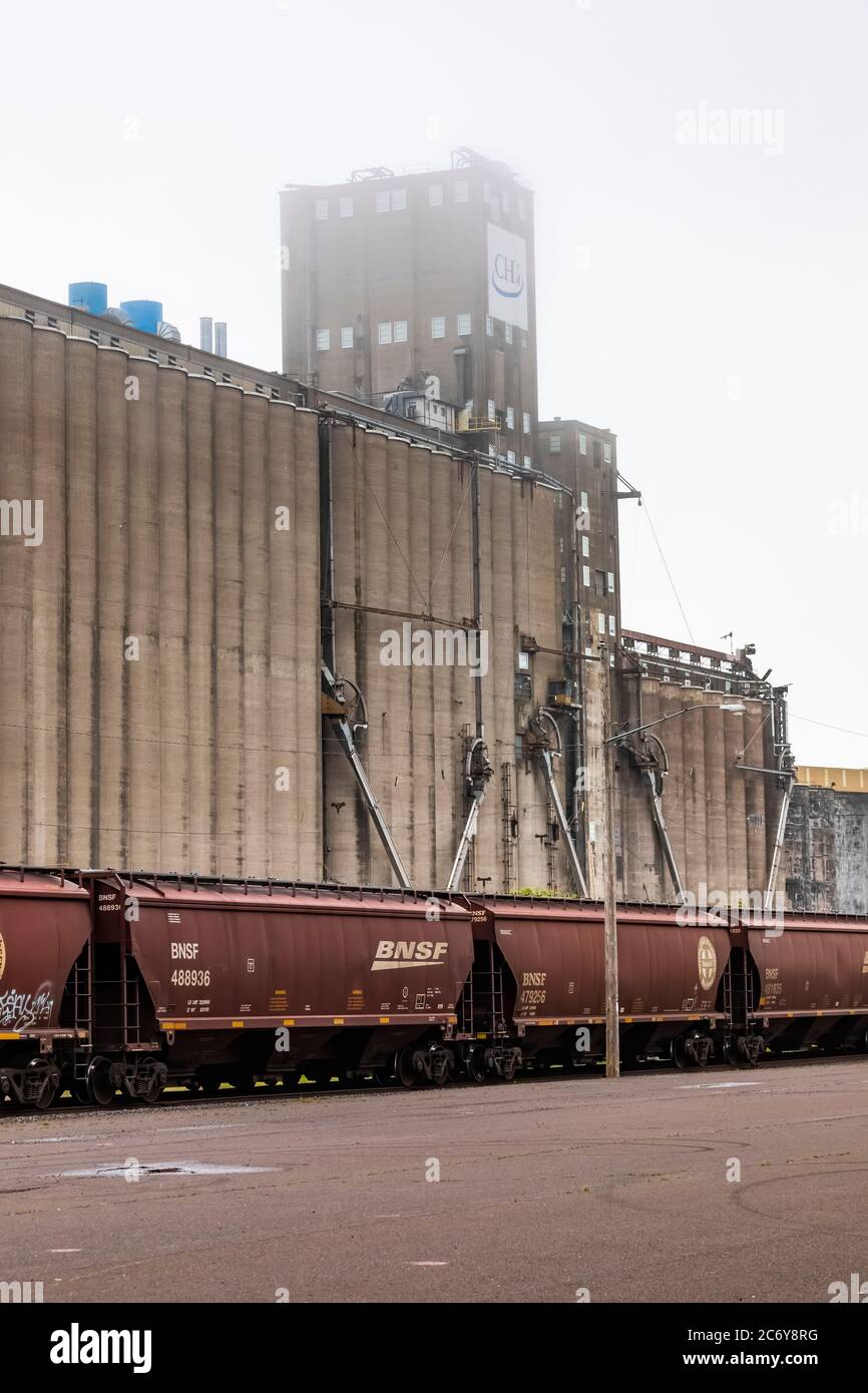 Grain silos and BNSF trains on the gritty waterfront of Superior, Wisconsin, USA [No property ...