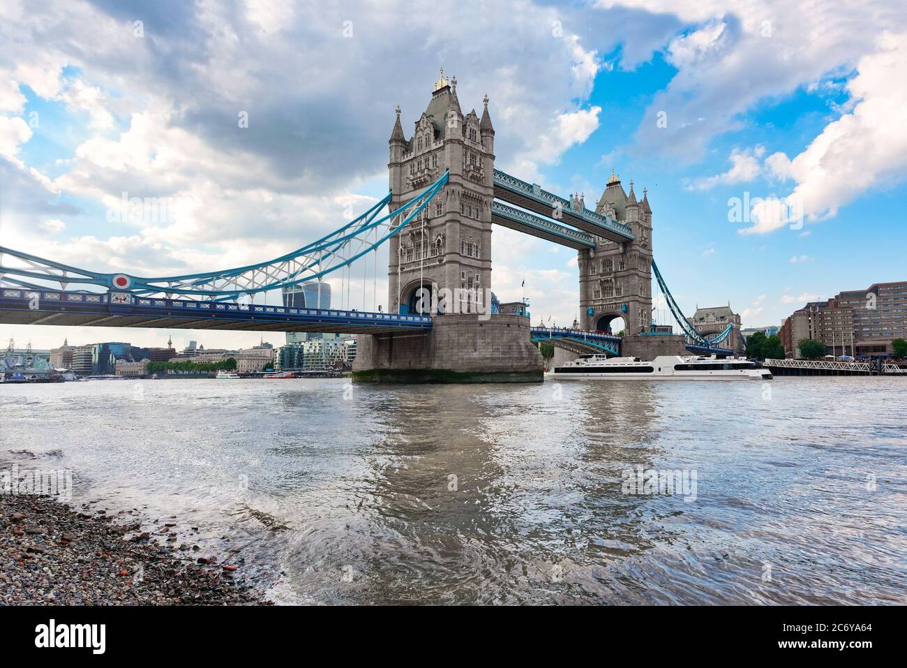 Iconic Tower Bridge in London in the late afternoon. The bridge crosses ...