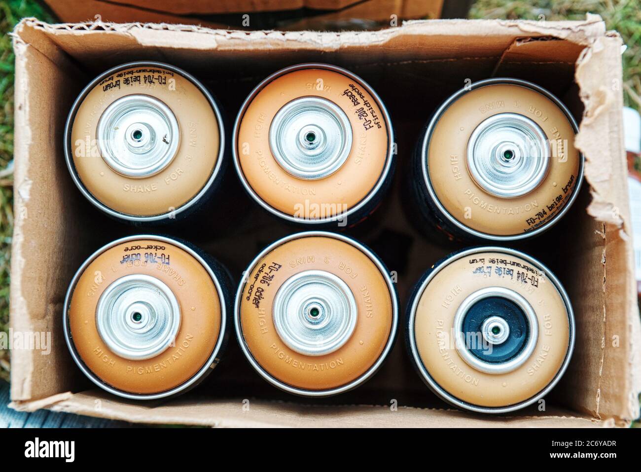 Colorful graffitty spray cans in a box Stock Photo - Alamy