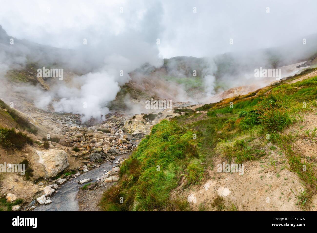 Picturesque view of volcanic landscape, aggressive hot spring, erupting ...