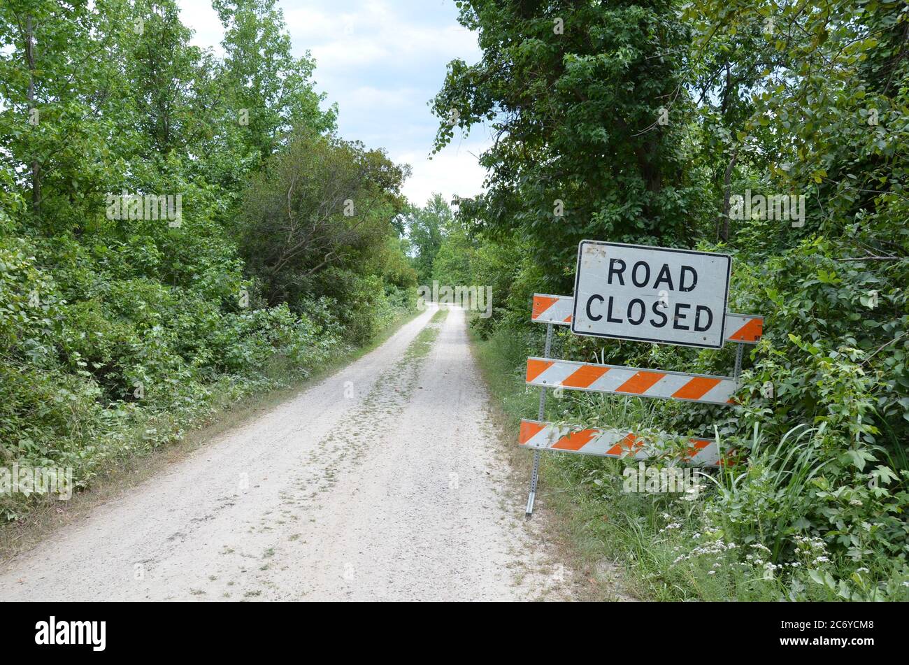 orange and white road closed sign with path or trail Stock Photo - Alamy