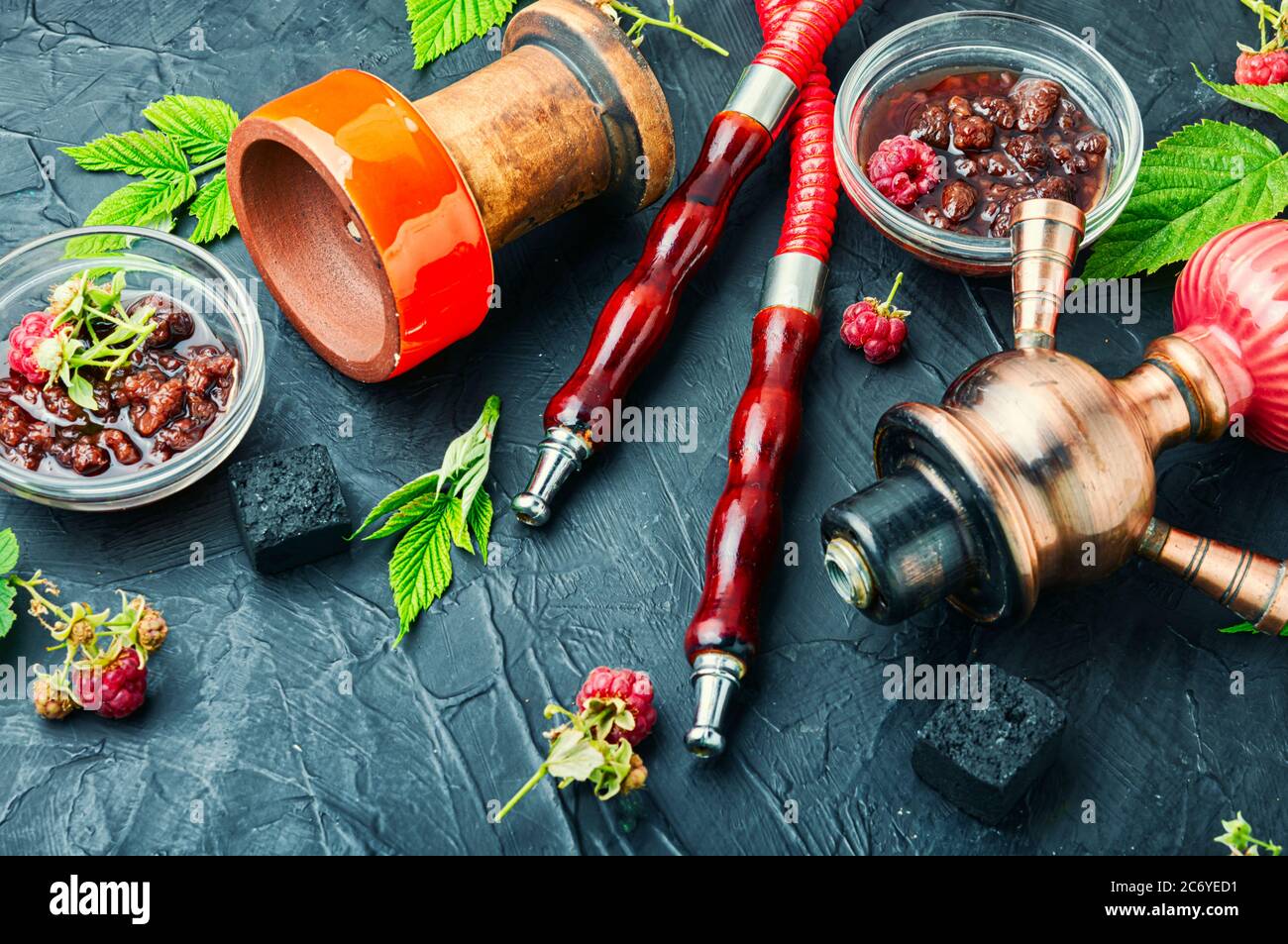 Smoking hookah with tobacco with the aroma of raspberry jam.Traditional ...
