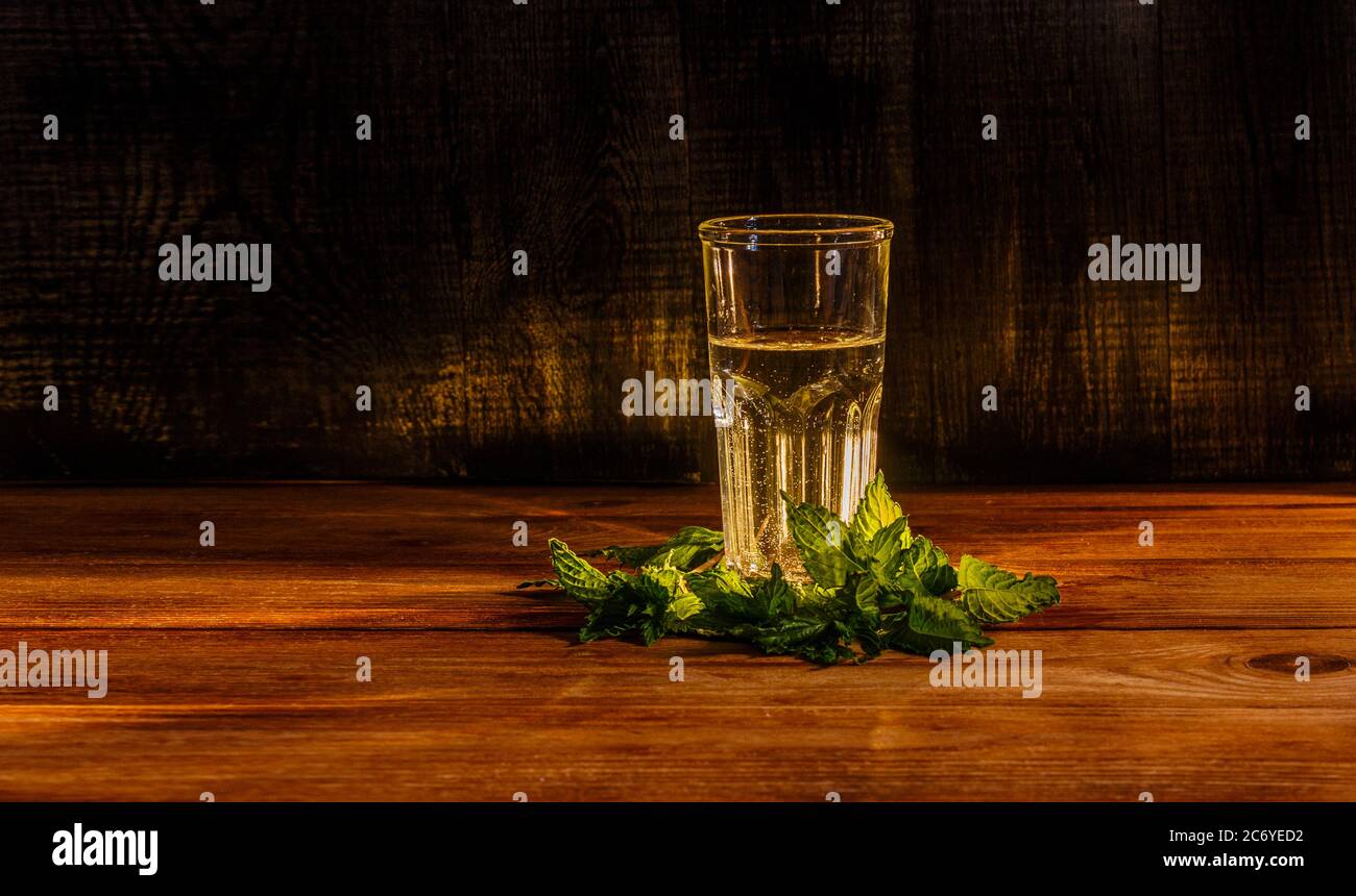 Bunch of fresh mint in a glass of water. Indoors, medicine Stock Photo ...