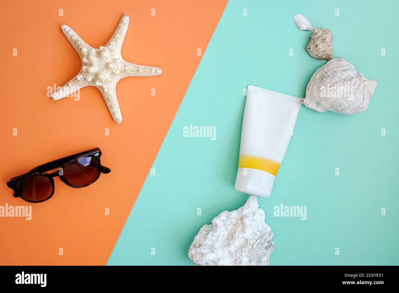 Sunscreen as part of natural composition from shell, stone. Flat lay on ...