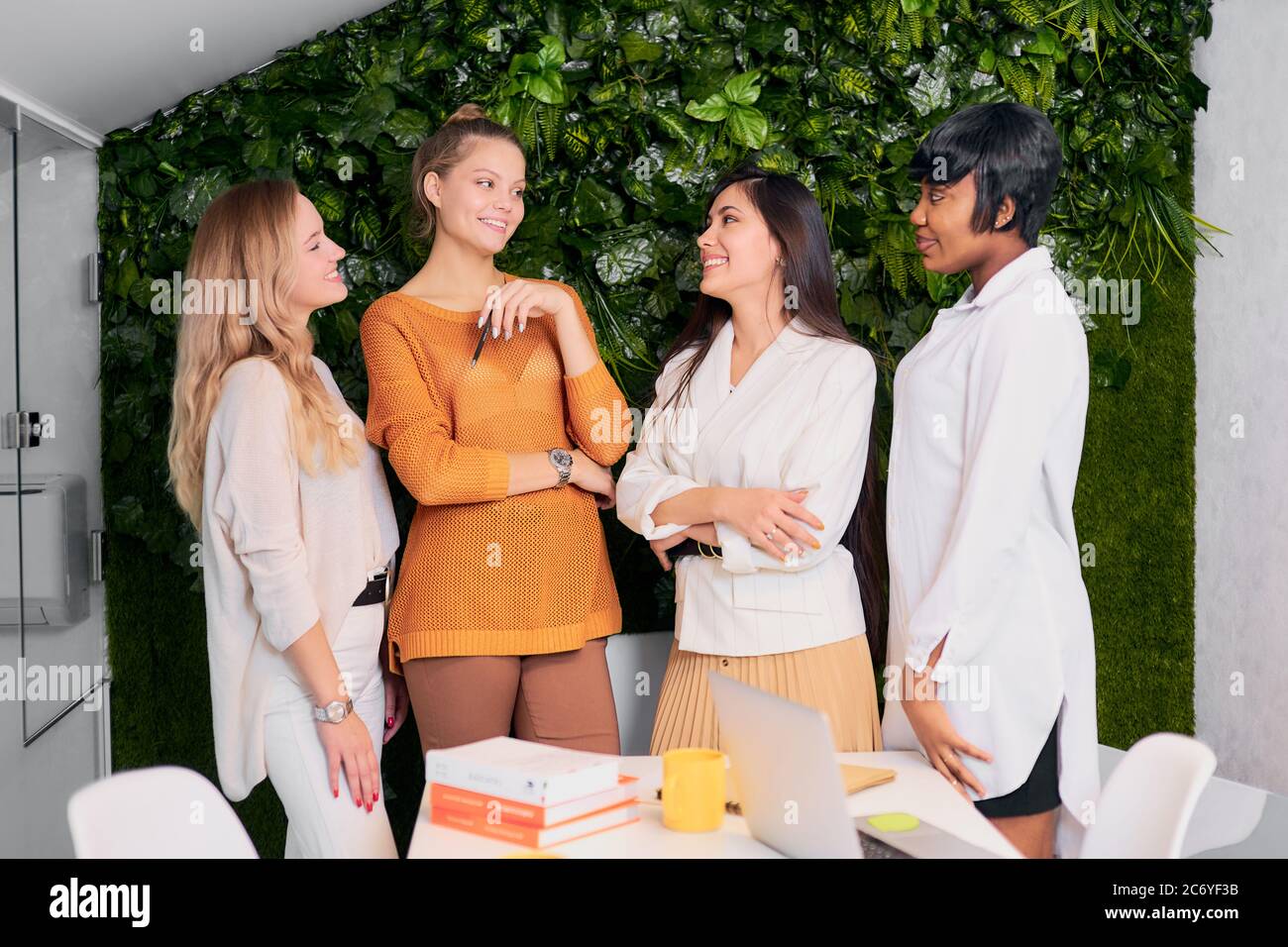 Creative teamwork of caucasian leader and diverse colleagues, look at ...