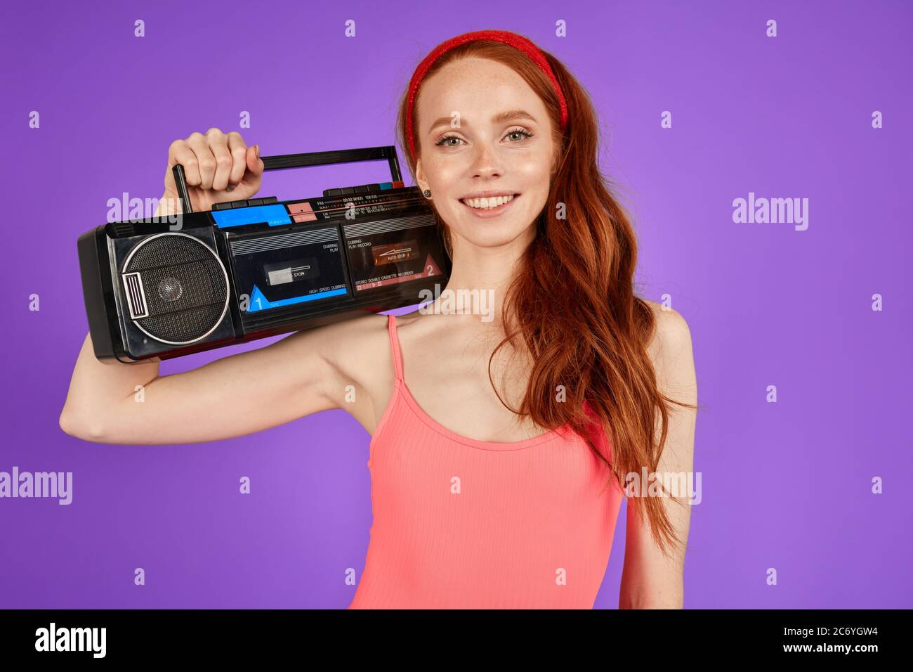 portrait of attractive young ginger female pop singer with cute ...