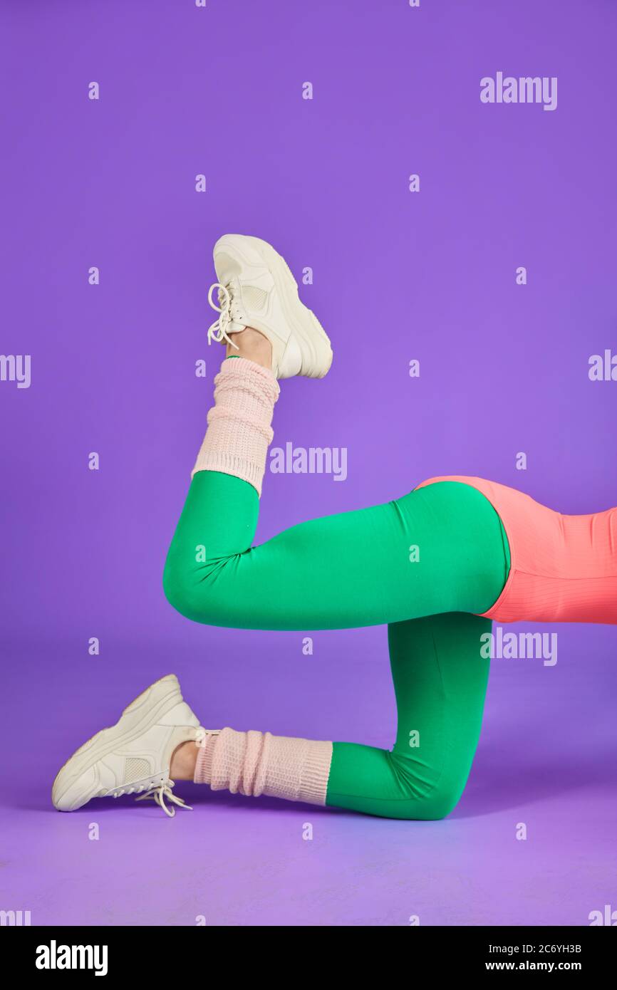 Unrecognizable Sporty Woman Lifts Bent Leg Up On All Fours Works Out Abdominals And Butt
