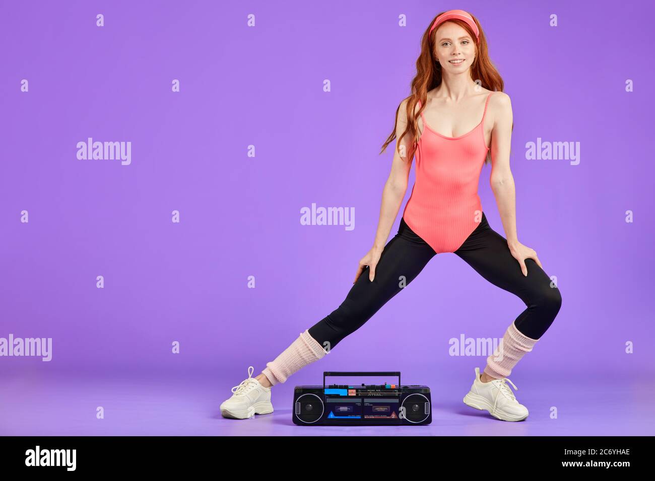 pretty fit aerobics trainer with long ginger hair takes part in TV ...