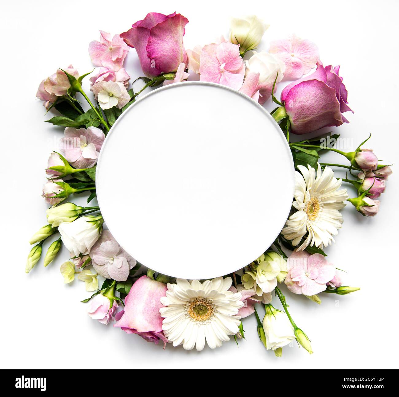 Pink roses and flowers in round frame with white circle for text on ...