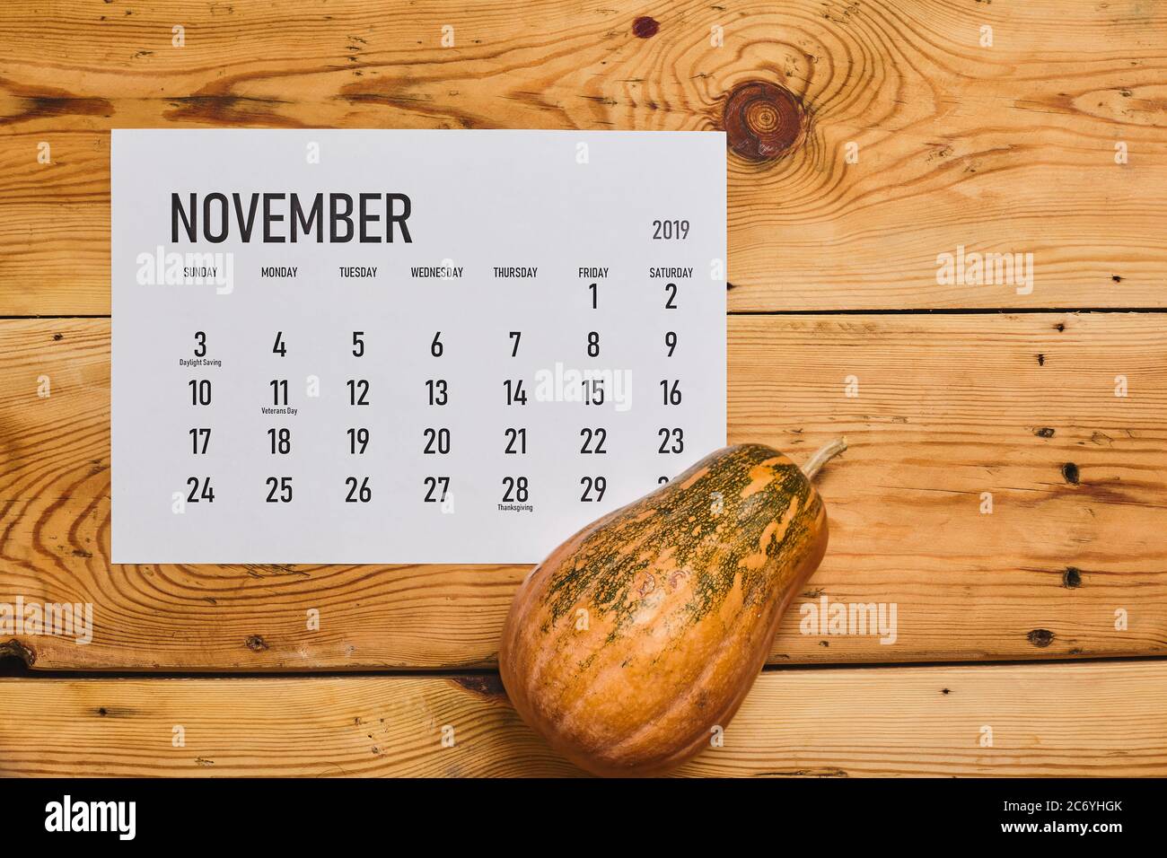 Simple November 2020 calendar decorated with pumpkins on wooden ...