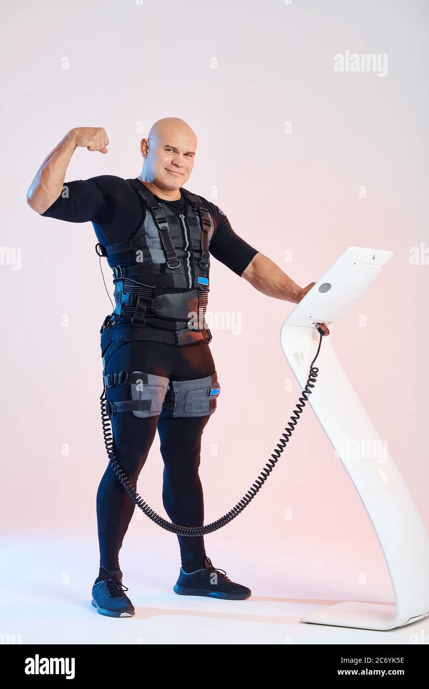 positive fit man showing his muscles duting workout. full length photo ...