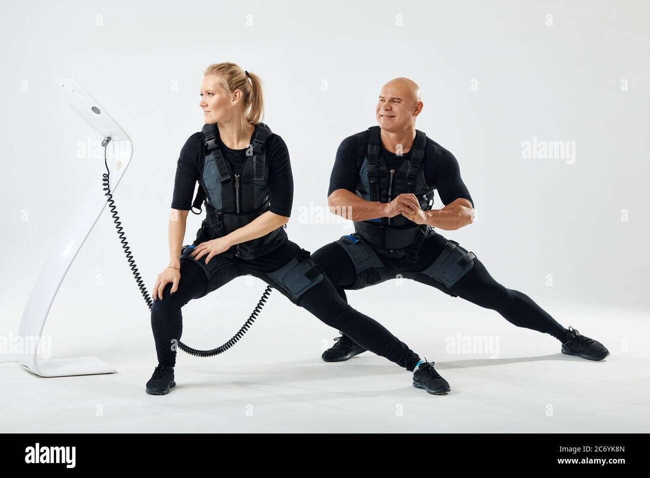 young strong people doing side forward lunge. isolated white background ...