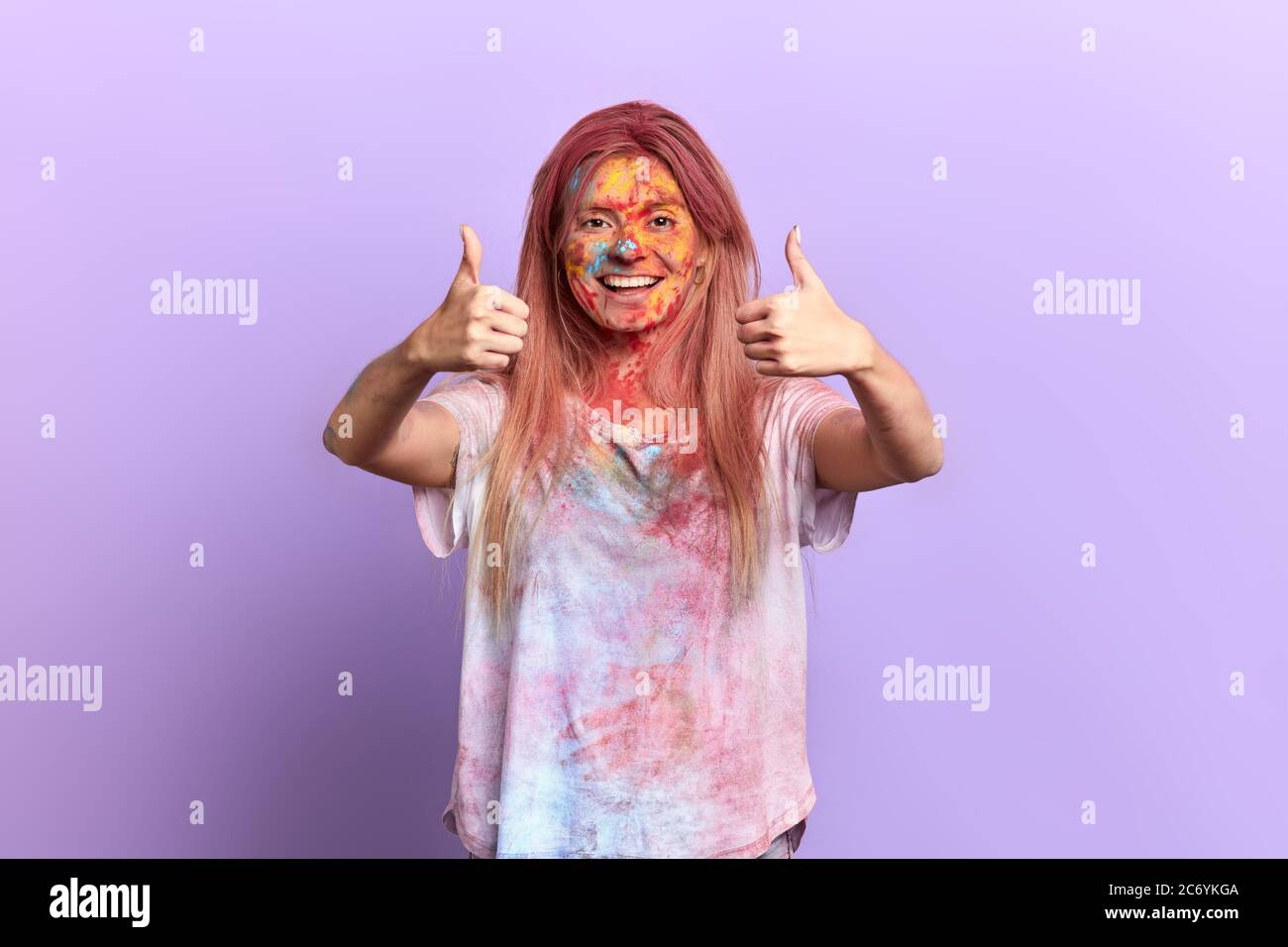 excited positive satisfied girl rejoicing at the color festival. close ...
