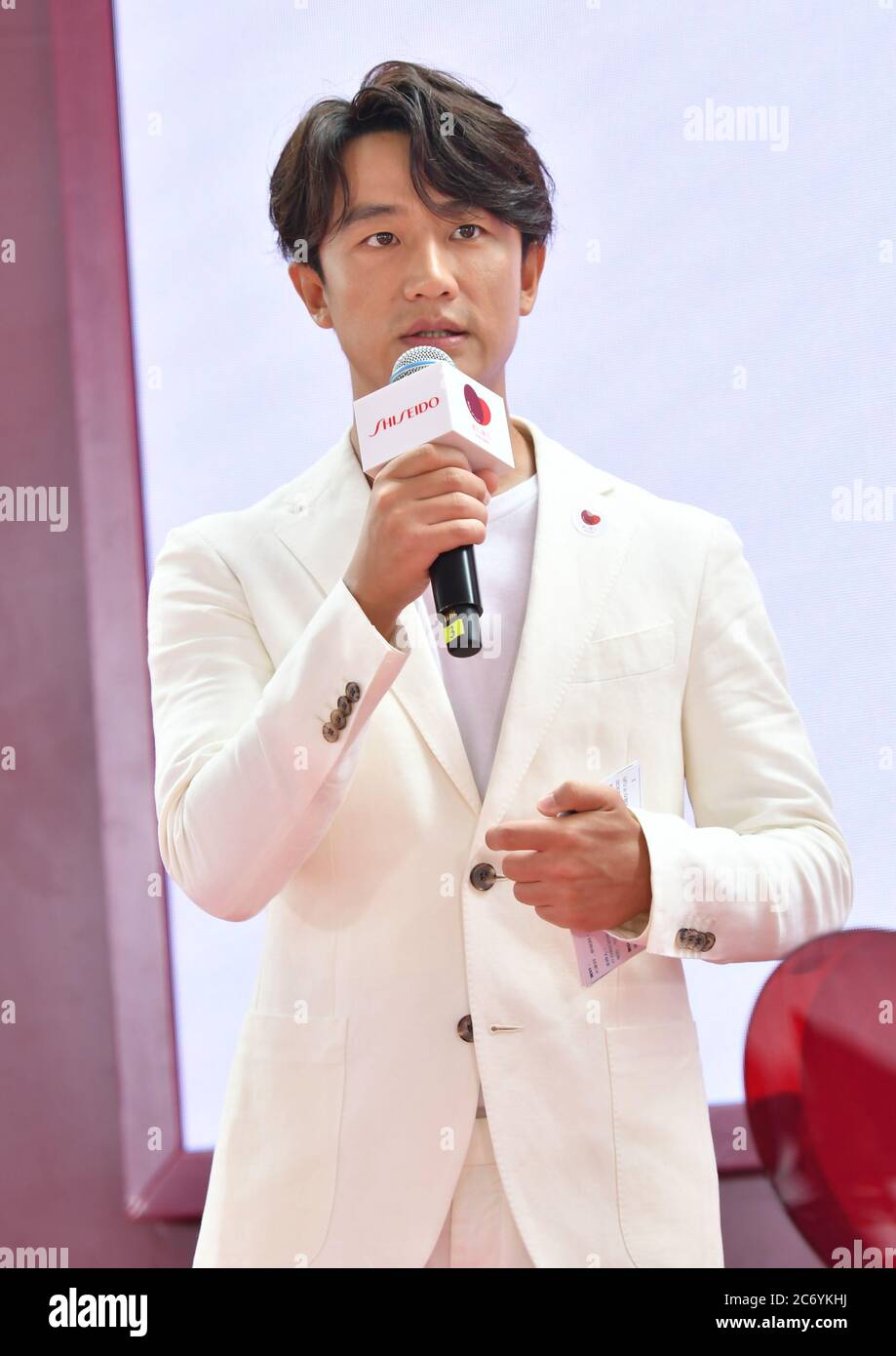 Chinese actor Huang Xuan attends a charity activity of a cosmetic brand ...
