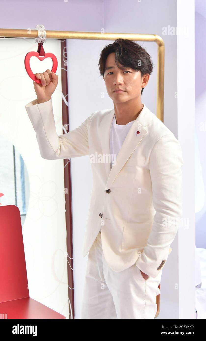 Chinese actor Huang Xuan attends a charity activity of a cosmetic brand ...