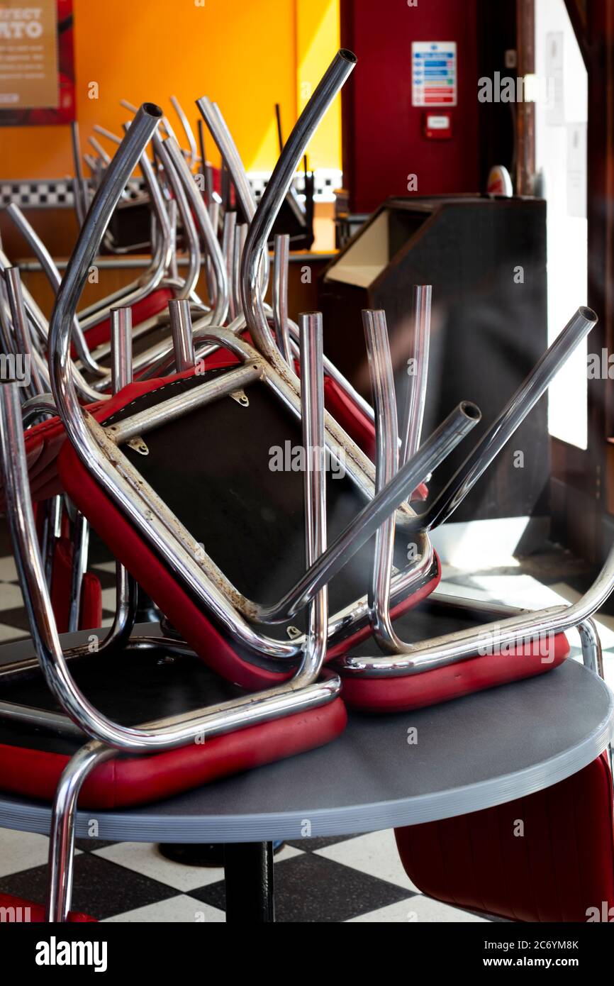 Restaurant with chairs stacked on tables closed for the retail sector ...