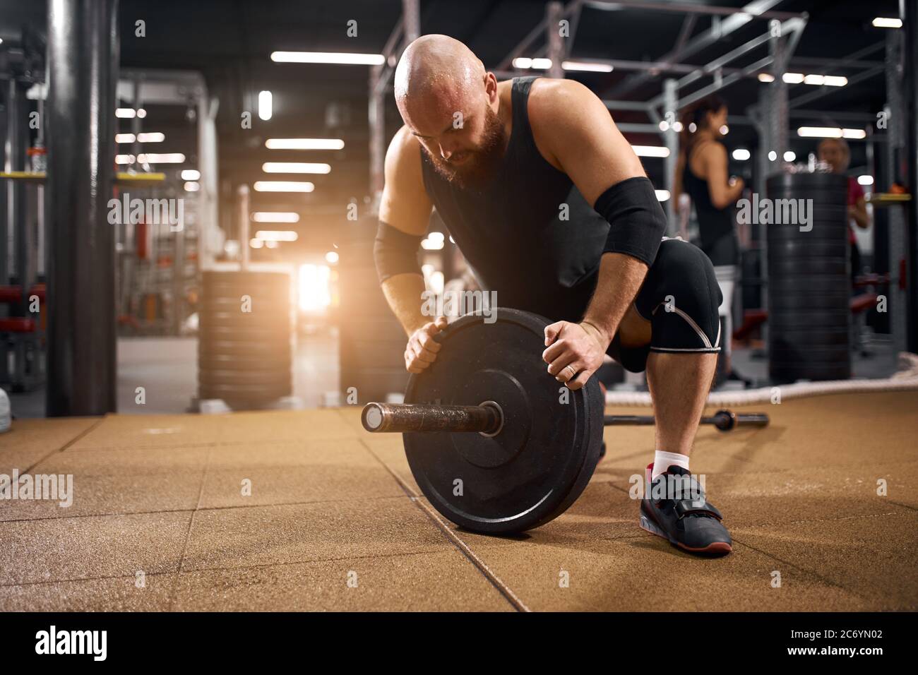 Strong beard weightlifter spending time in gym, working hard, preparing ...