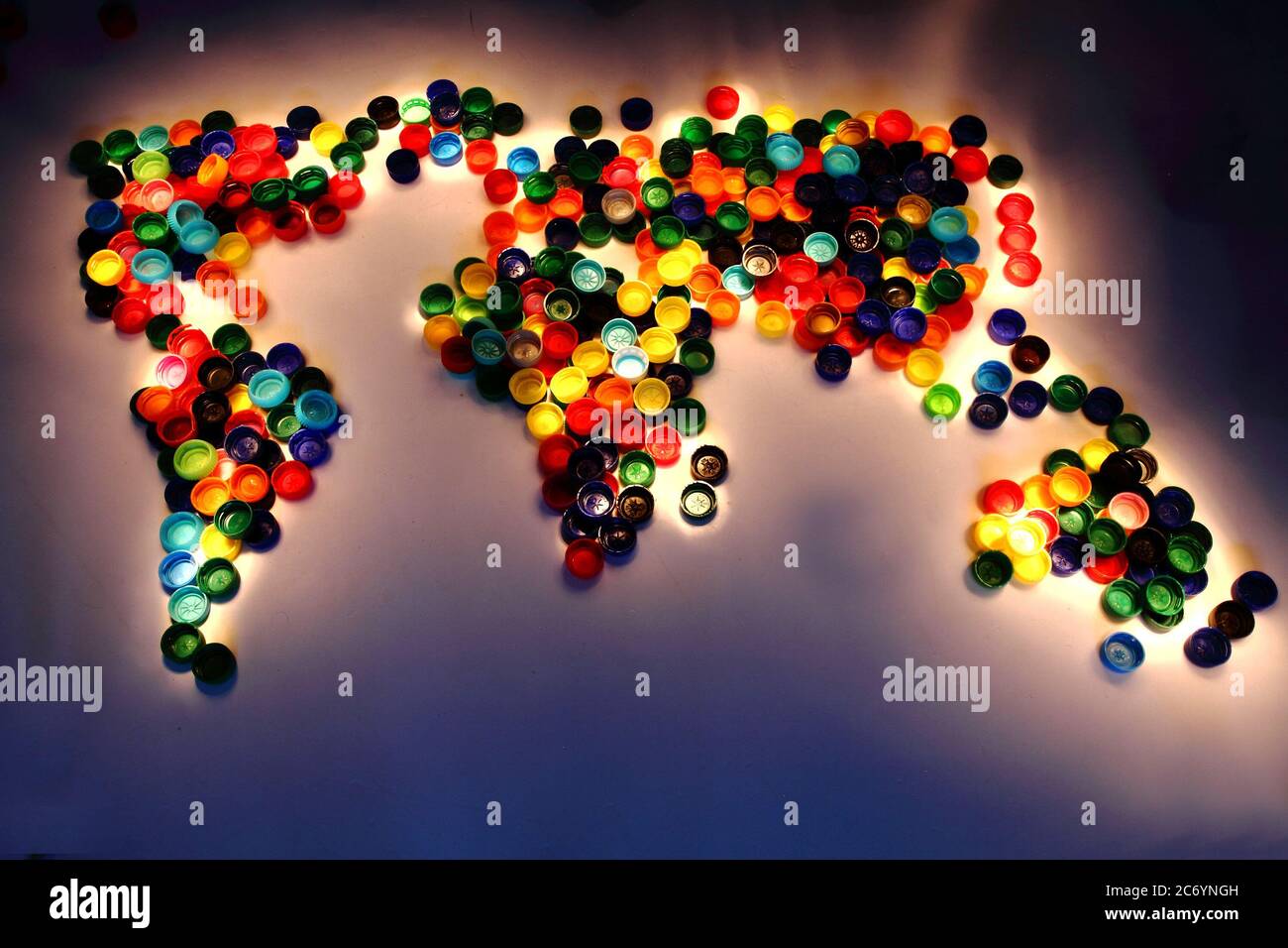 world map from the plastic caps in the dark Stock Photo - Alamy