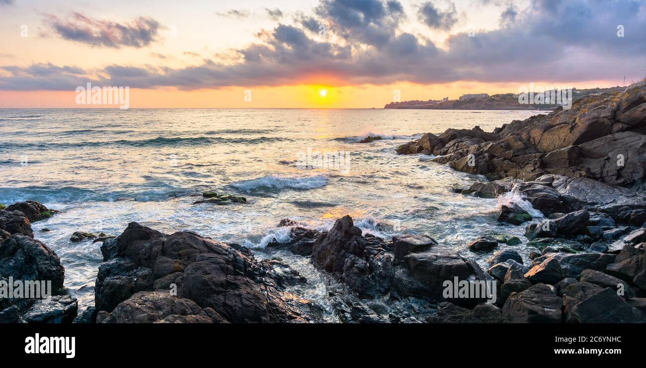 coast of the ocean at sunset. beautiful landscape with rocks in the ...
