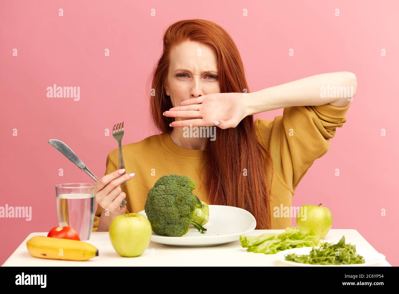 Red-haired frustrated confused disgusted displeased female model ...