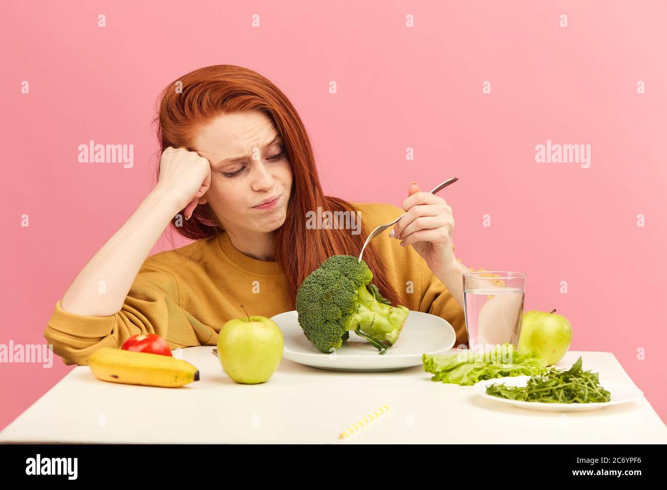 Red-haired frustrated confused disgusted displeased female model ...
