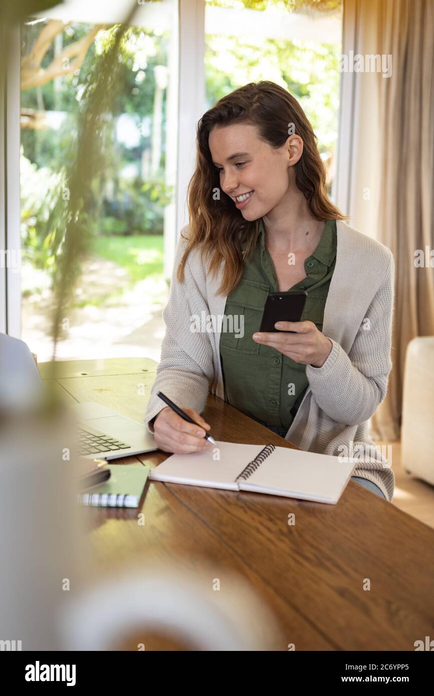 Woman taking notes hi-res stock photography and images - Alamy