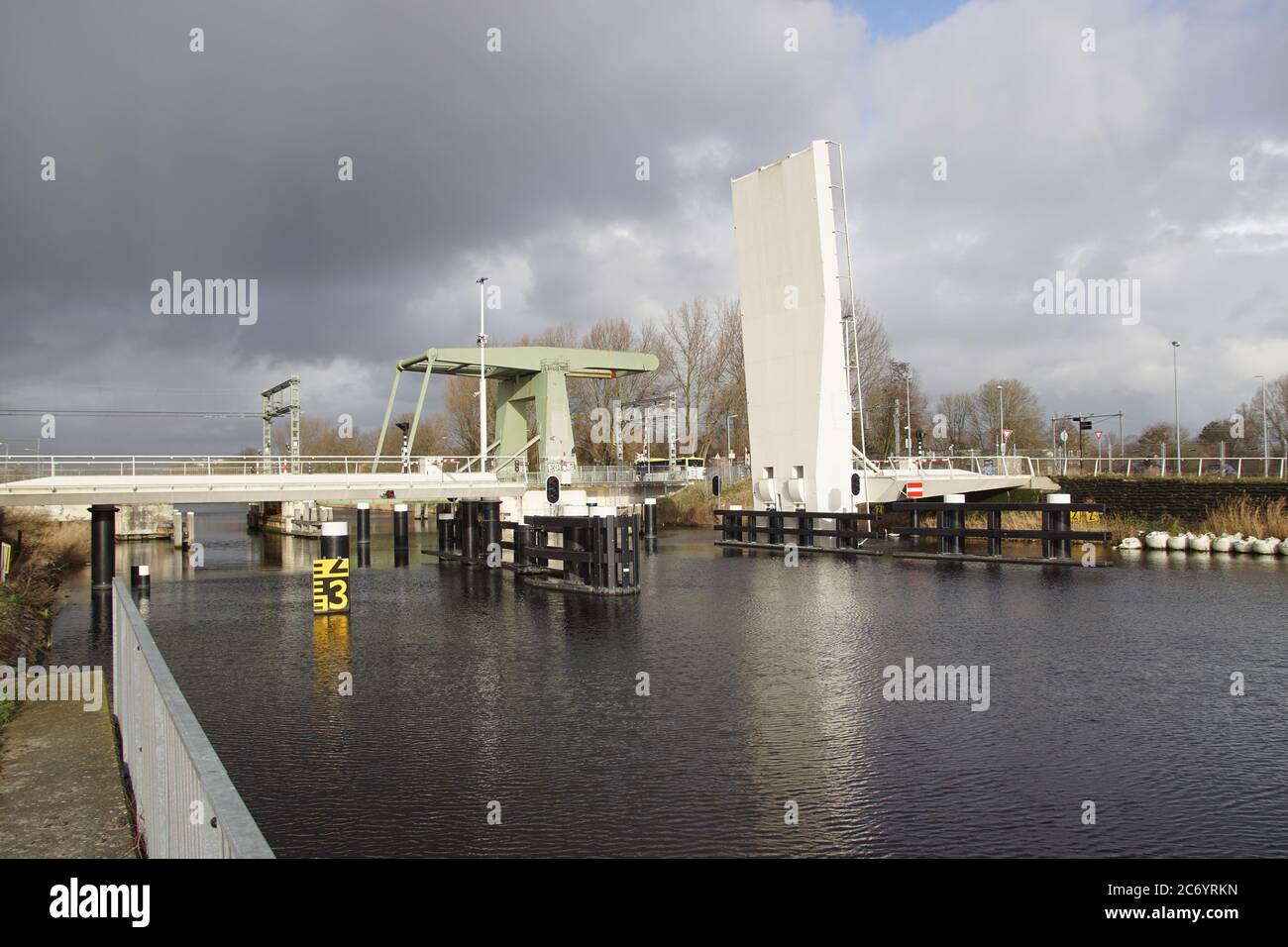 Newly built drawbridge and an older drawbridge for the train across a ...