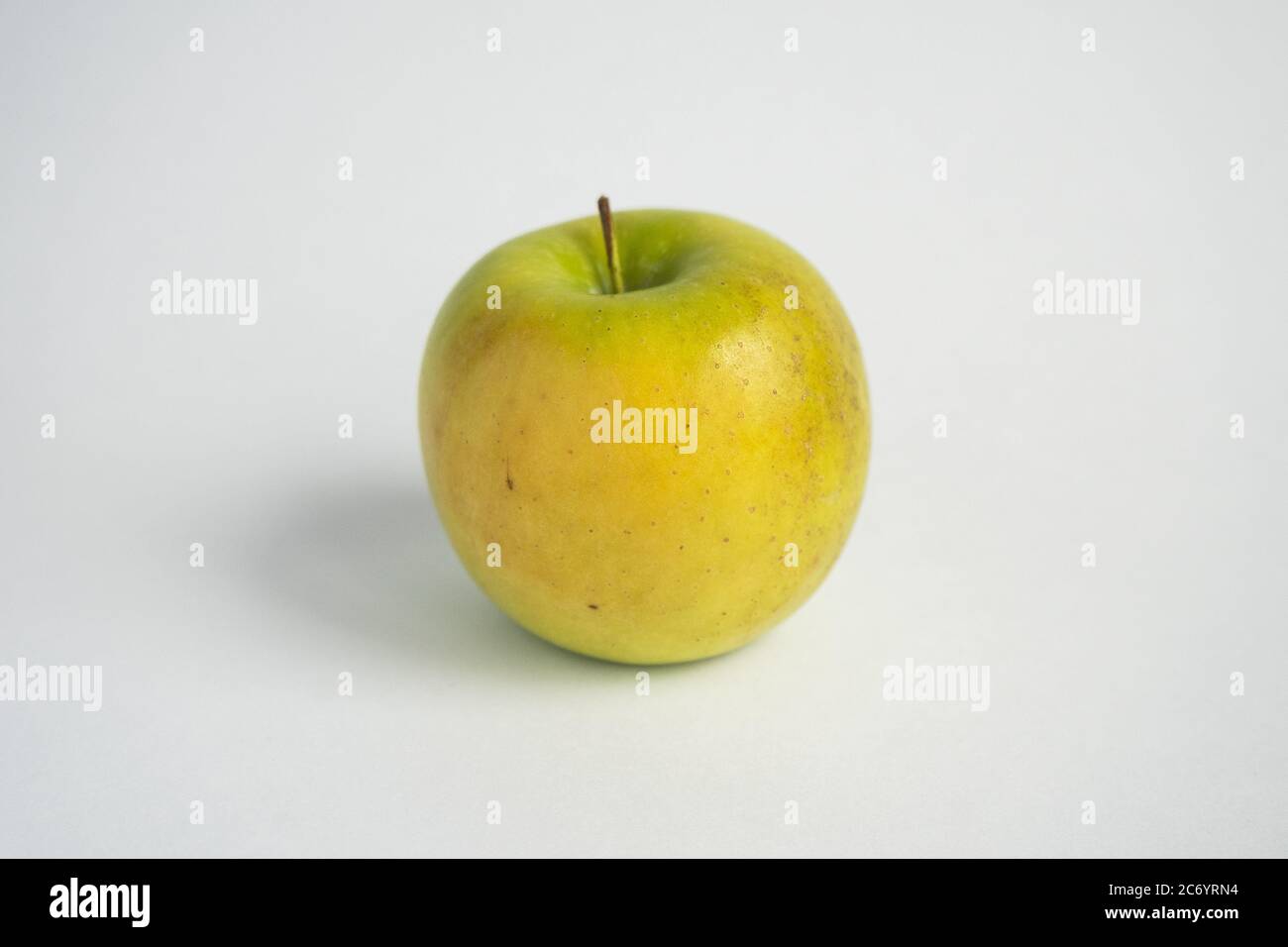 green-yellow apple on a white background. Fruit isolate Stock Photo - Alamy