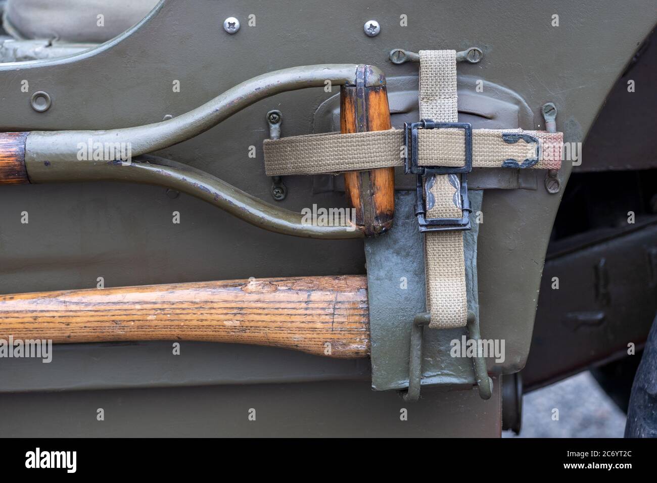 Detail of different work tools on the side of the military vehicle ...