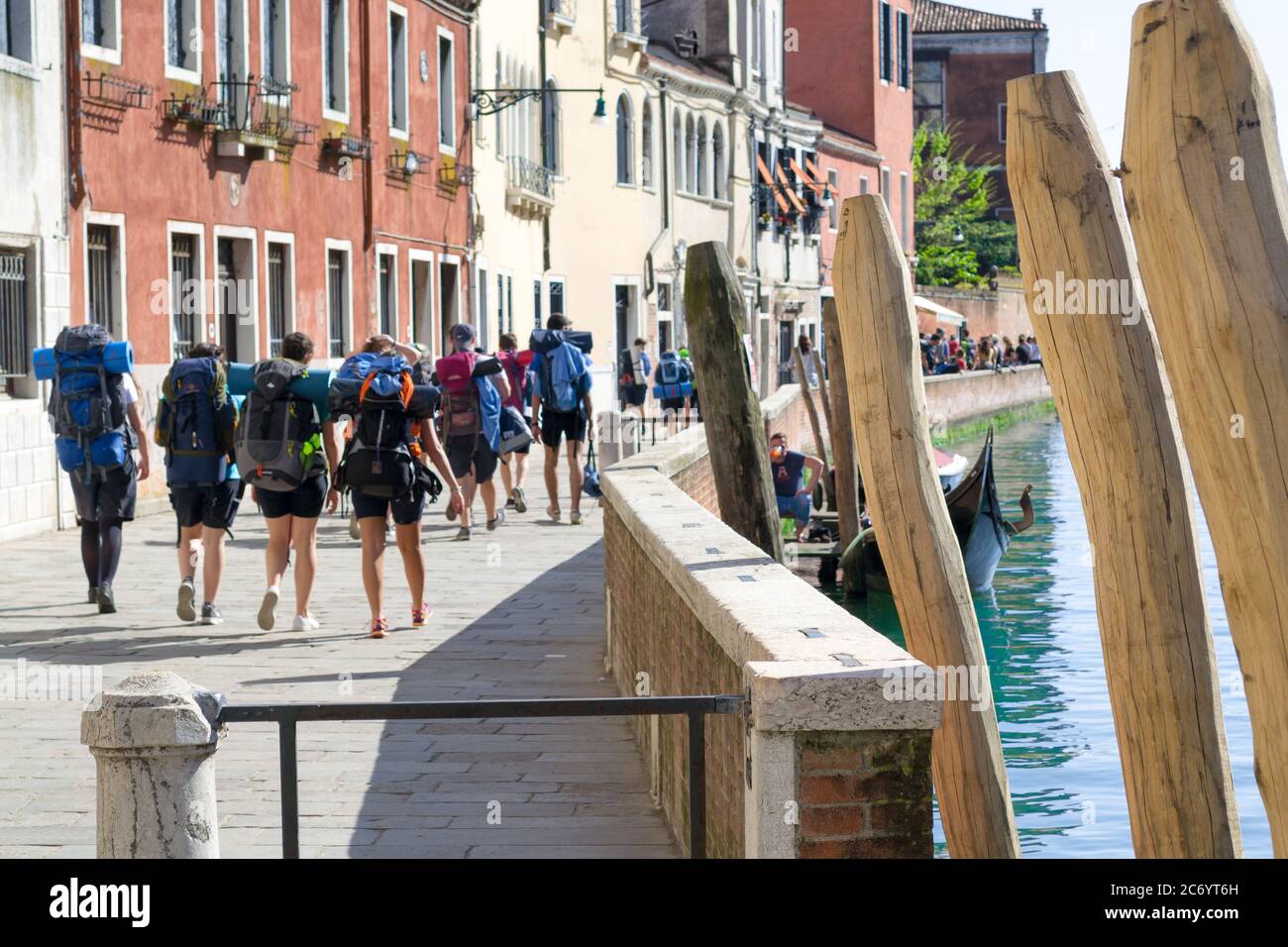 Venice, Italy, april 2018. A group of boy-scouts hike through the city ...