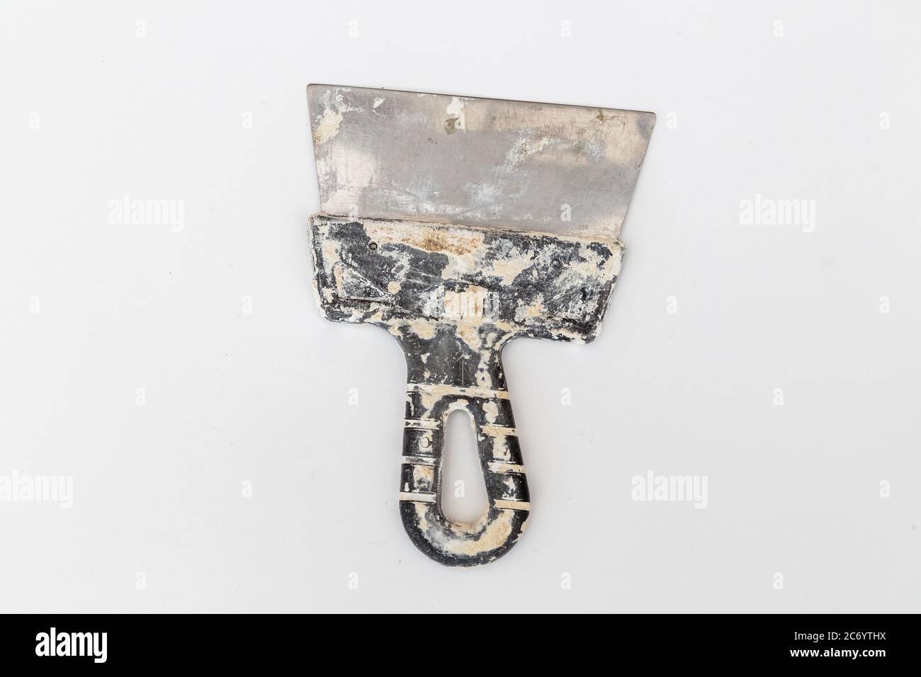 Old used spatula for repair on a white background Stock Photo - Alamy